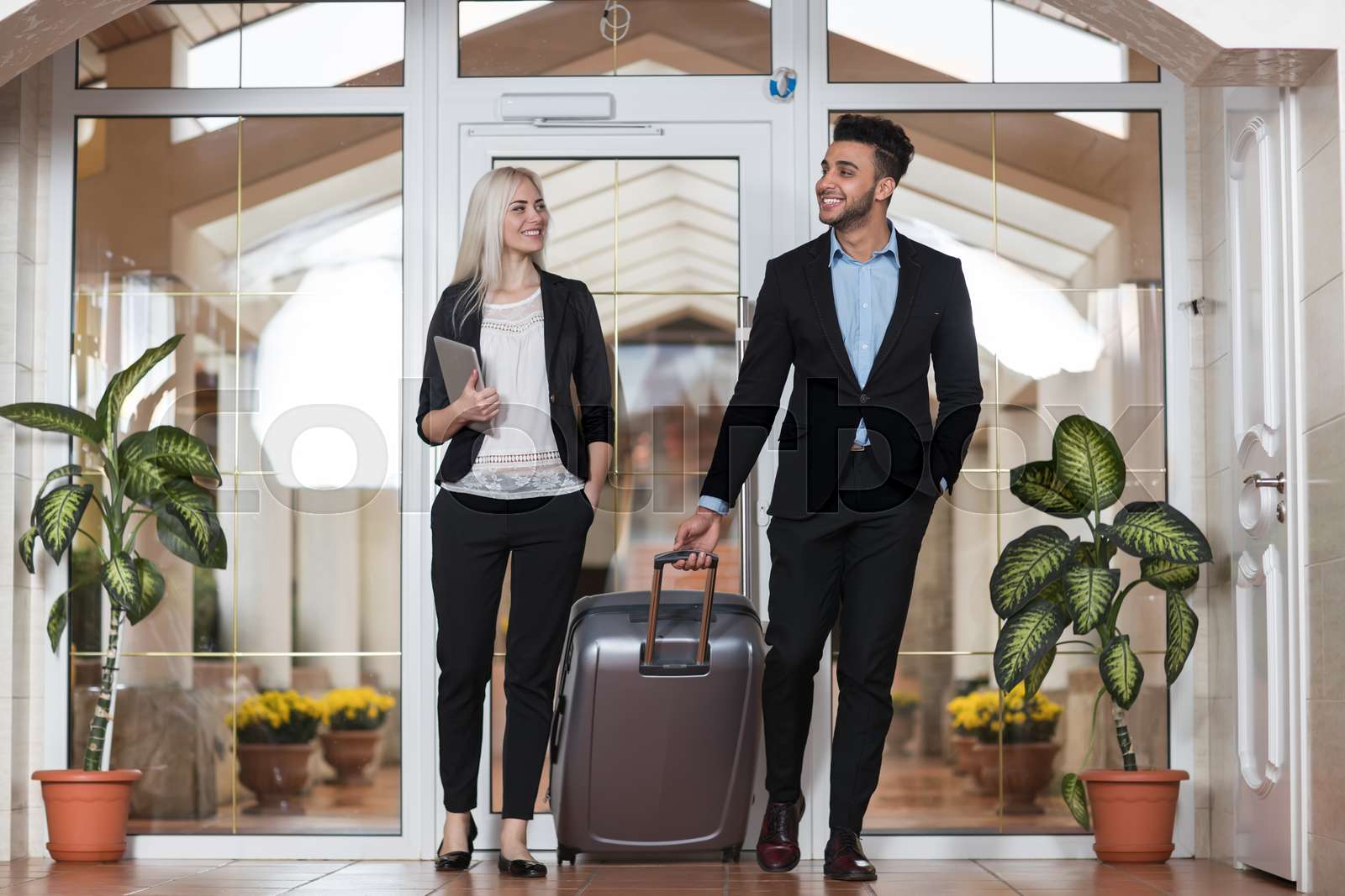 Business Couple In Hotel Lobby, Businesspeople Group Man And Woman ...