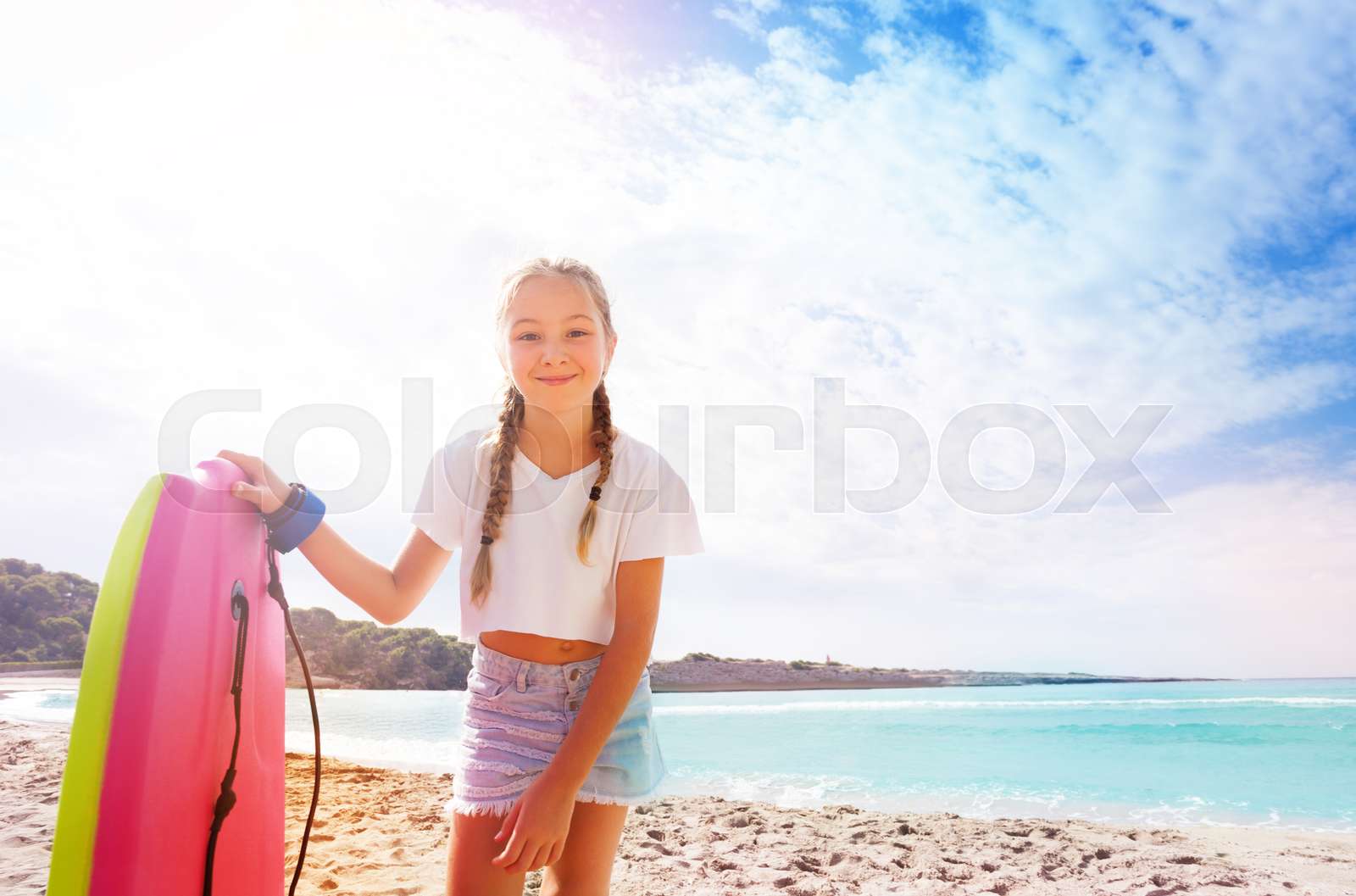 Girl On Sandy Sunny Beach Bending Over Camera Stock Image Colourbox