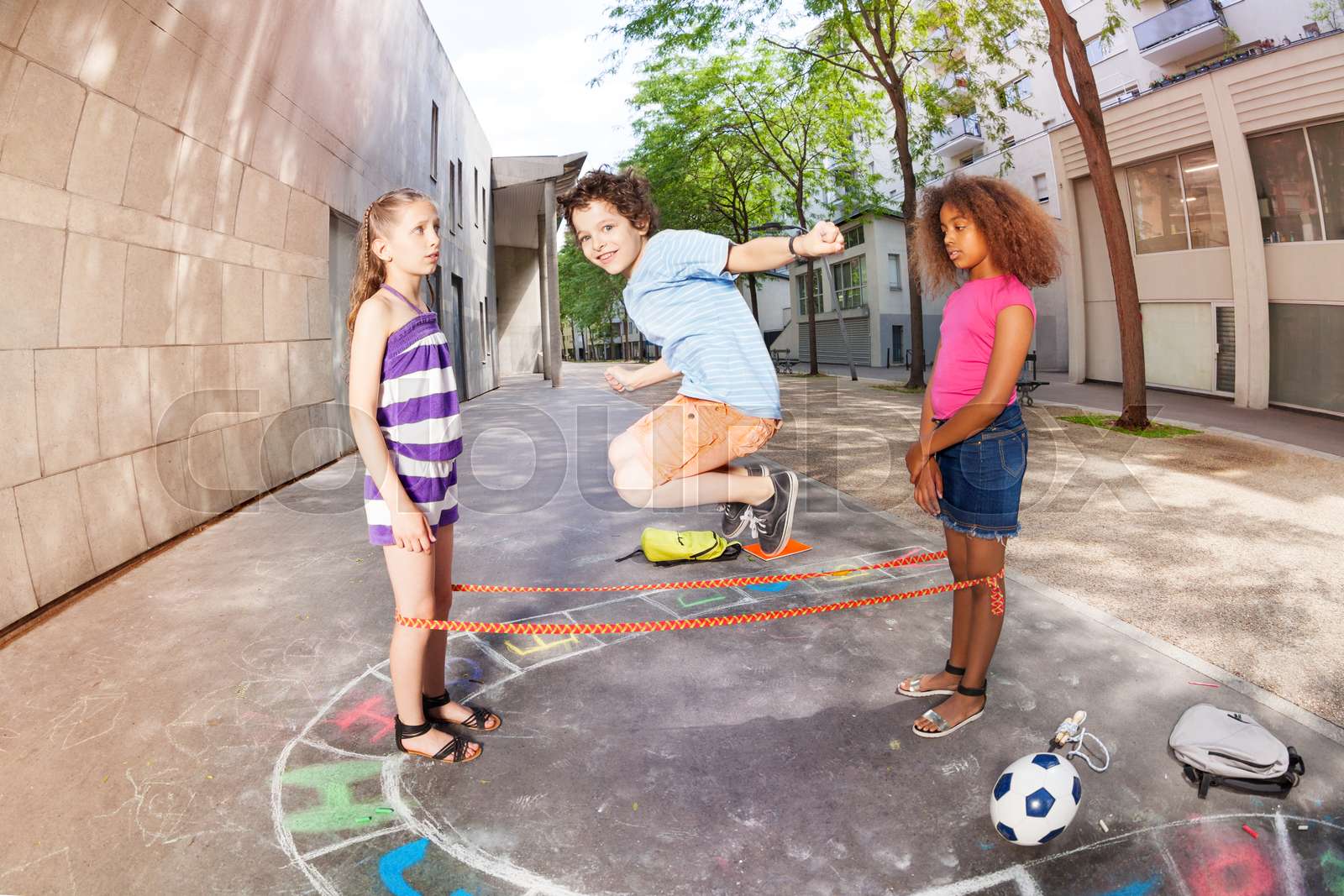 Group of kids play yoki game together | Stock image | Colourbox