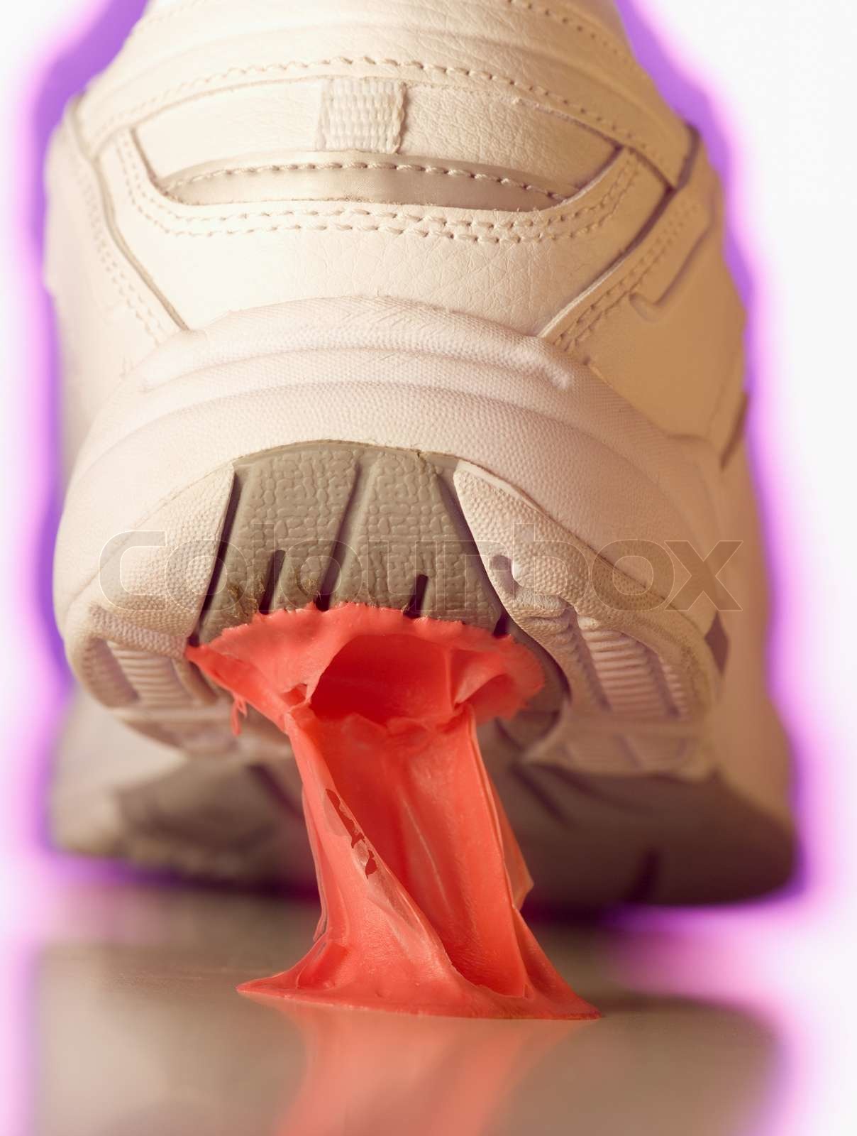 Close-up of gum stuck to a canvas shoe | Stock image | Colourbox