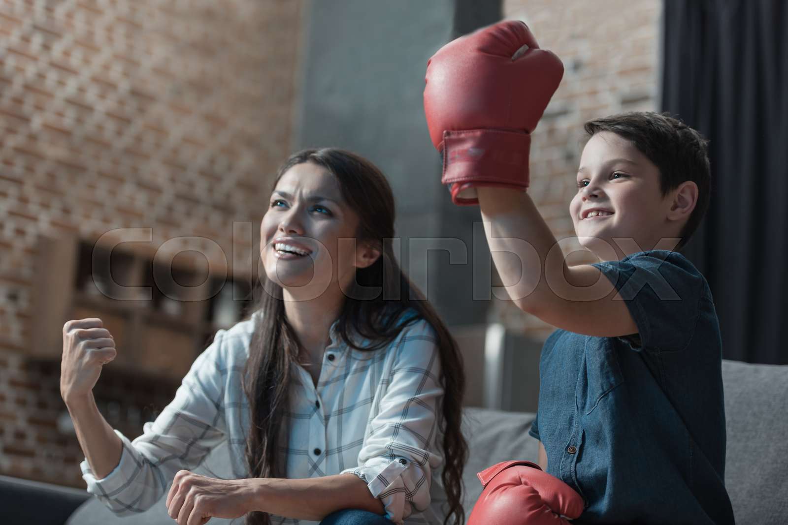 Cheering family watching boxing match | Stock image | Colourbox
