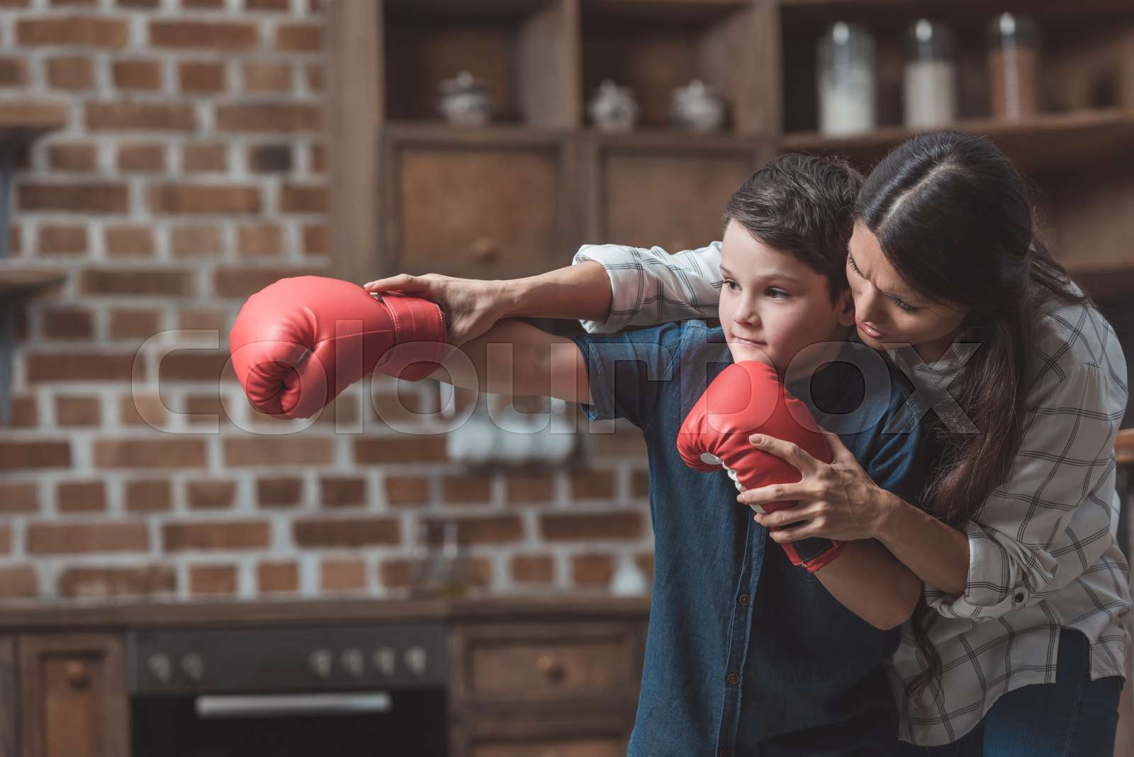 Mother and son practice boxing | Stock image | Colourbox