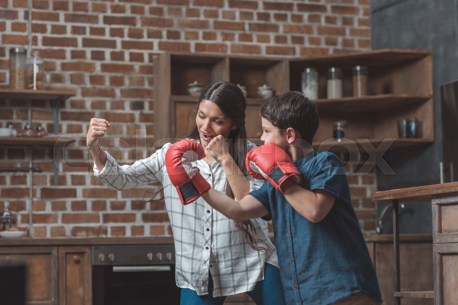 Mother and son practice boxing | Stock image | Colourbox