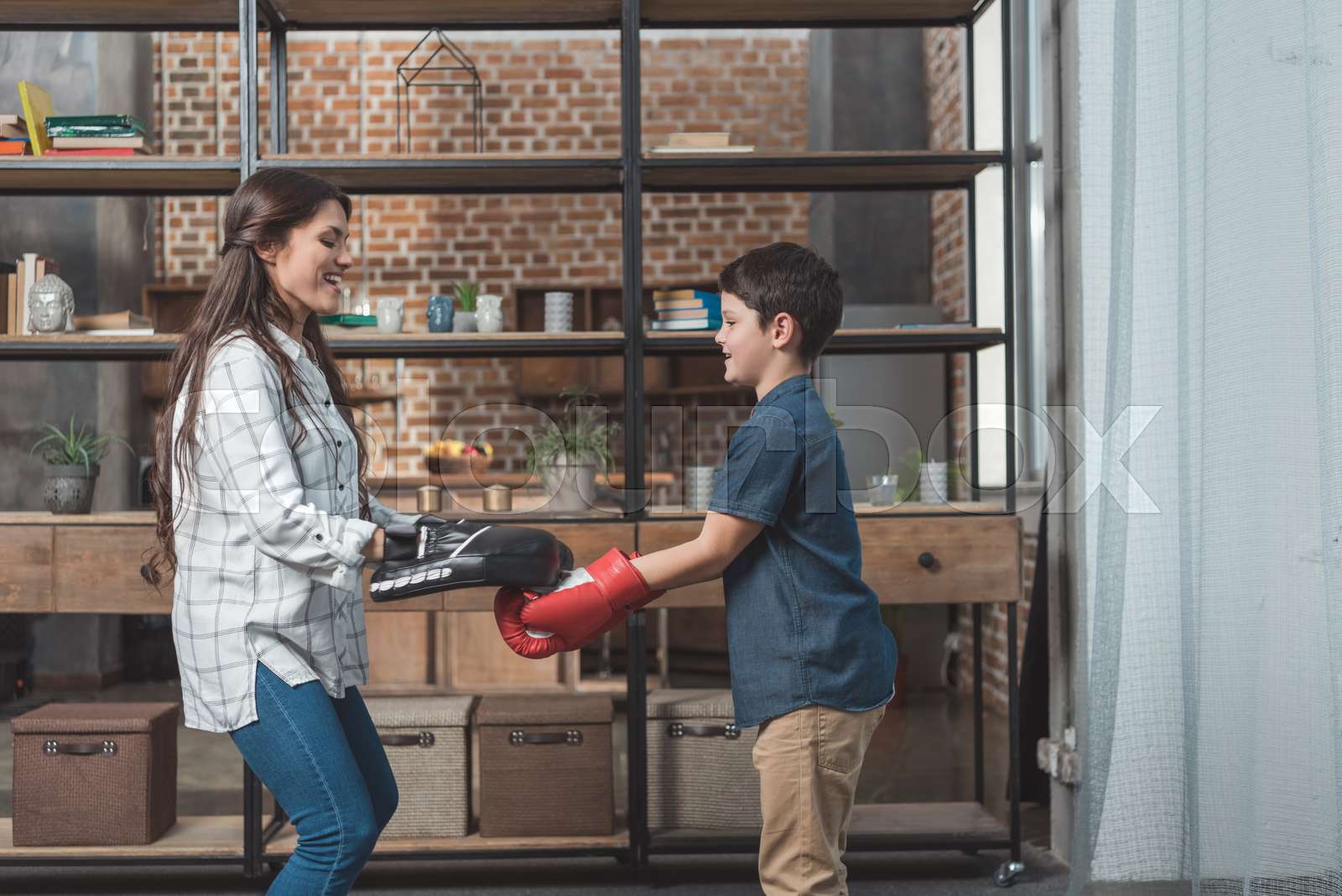 Mother and son practice boxing | Stock image | Colourbox