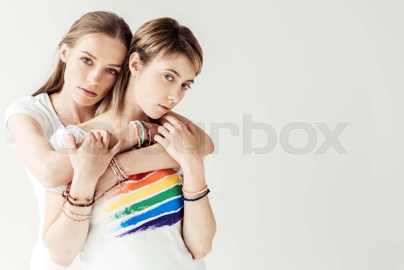 Woman hugging girlfriend from back | Stock image | Colourbox