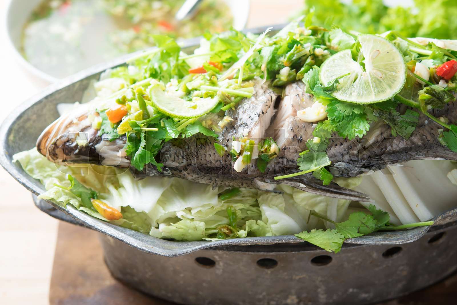 Steamed snapper fish with Herb and Spicy Sauce,Thai food | Stock image ...