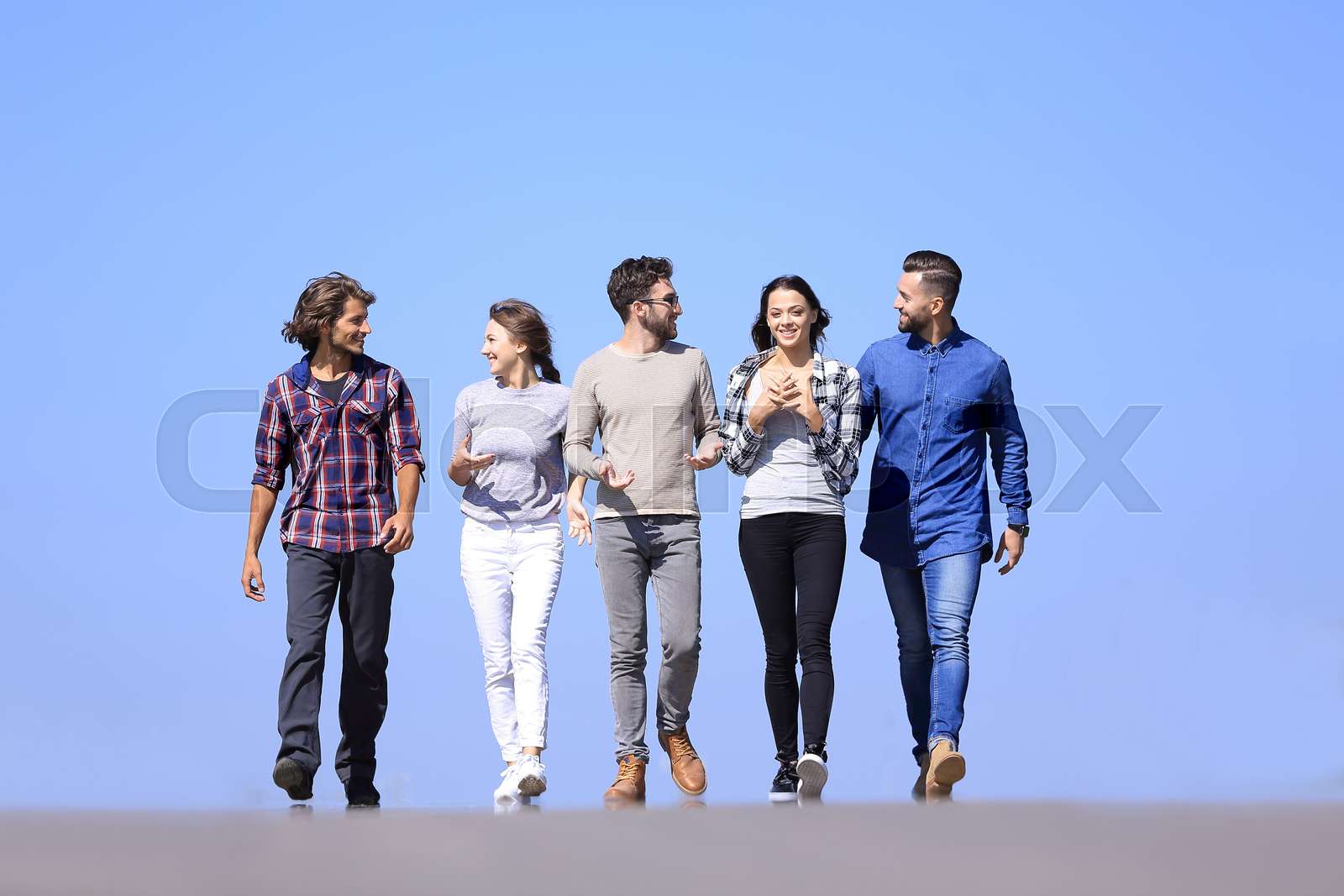 young people walking along the road. | Stock image | Colourbox