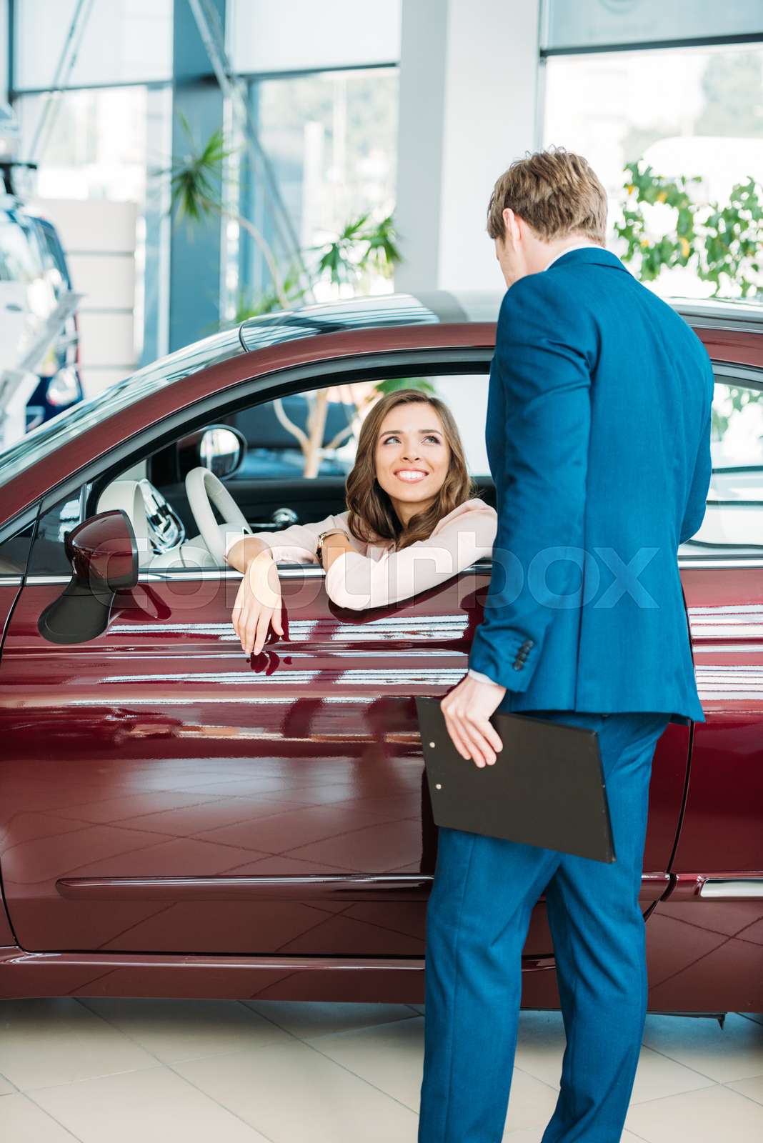 Manager talking with customer | Stock image | Colourbox