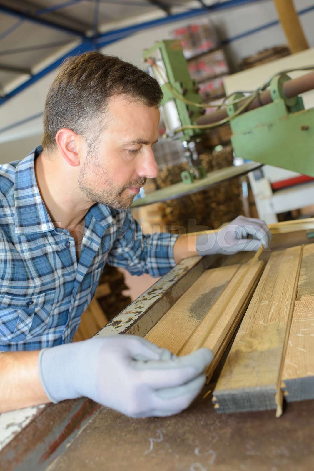 sawmill employee working with wood tools and machinery | Stock image ...