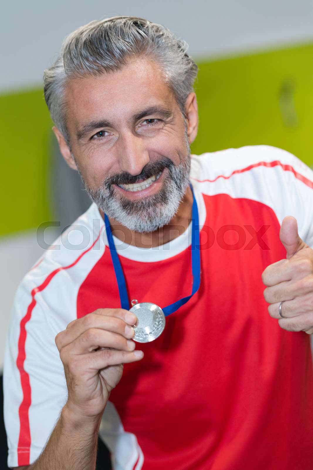 man wearing silver medal | Stock image | Colourbox