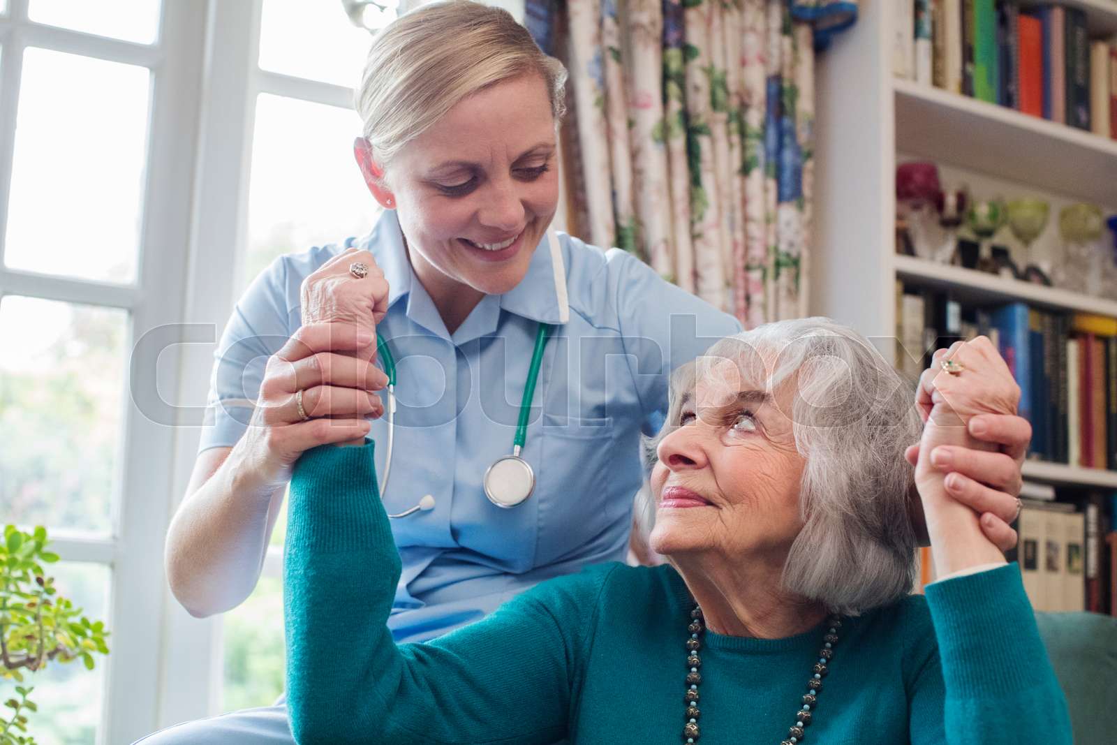 Nurse Assessing Stroke Victim By Raising Arms Stock Image Colourbox