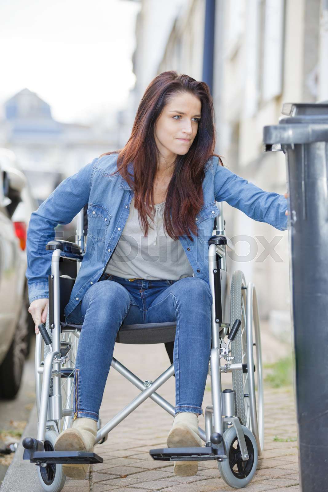 disabled woman rides a wheelchair | Stock image | Colourbox