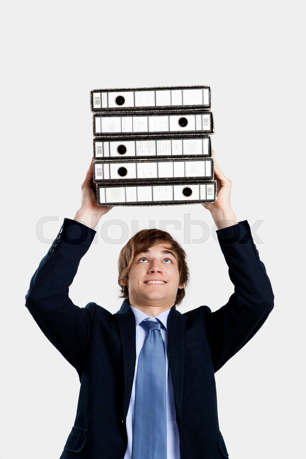 Business man carrying folders | Stock image | Colourbox