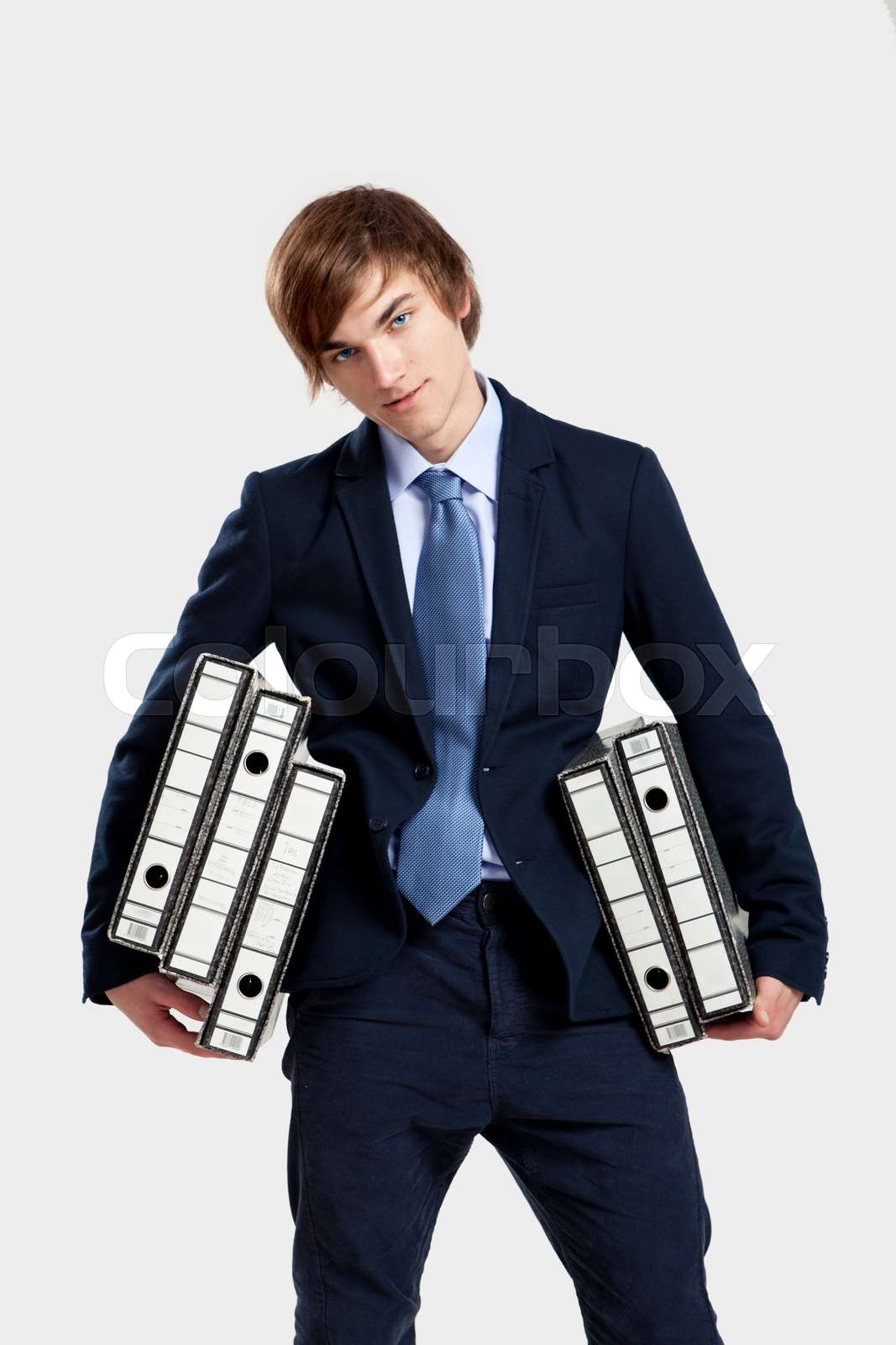 Business man carrying folders | Stock image | Colourbox