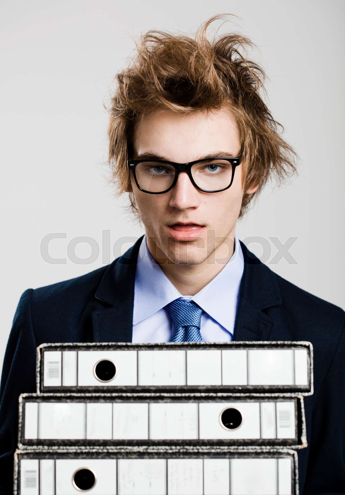 Business man carrying folders | Stock image | Colourbox