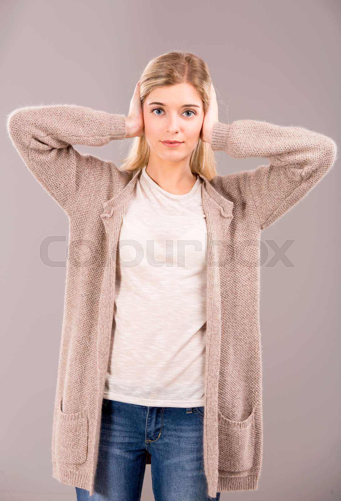 Covering ears with hands | Stock image | Colourbox