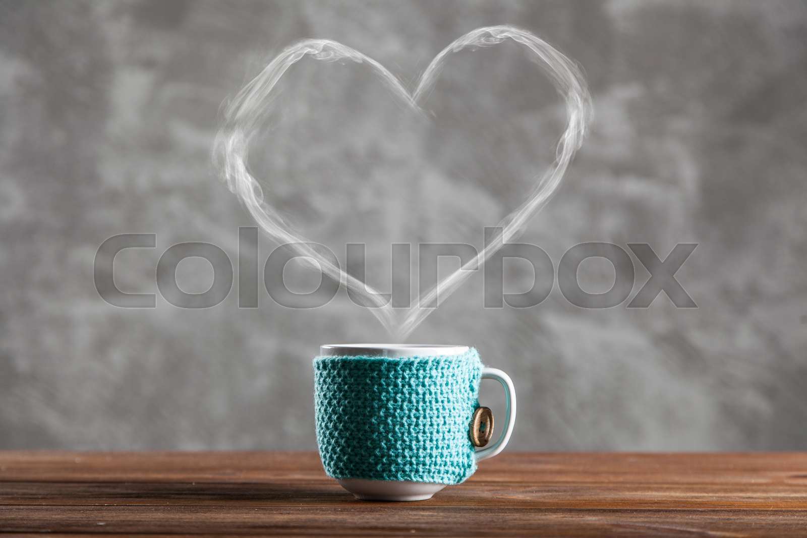 Cup of coffee with a heart shaped steam | Stock image | Colourbox