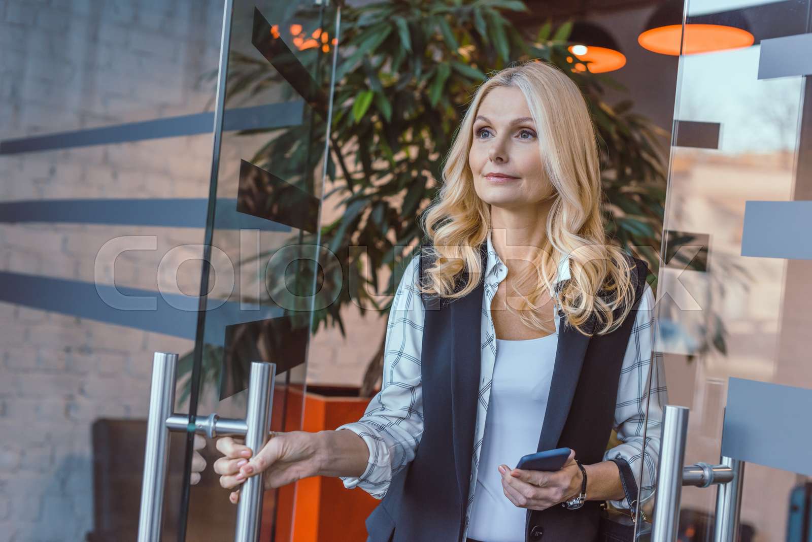 woman going out of office | Stock image | Colourbox