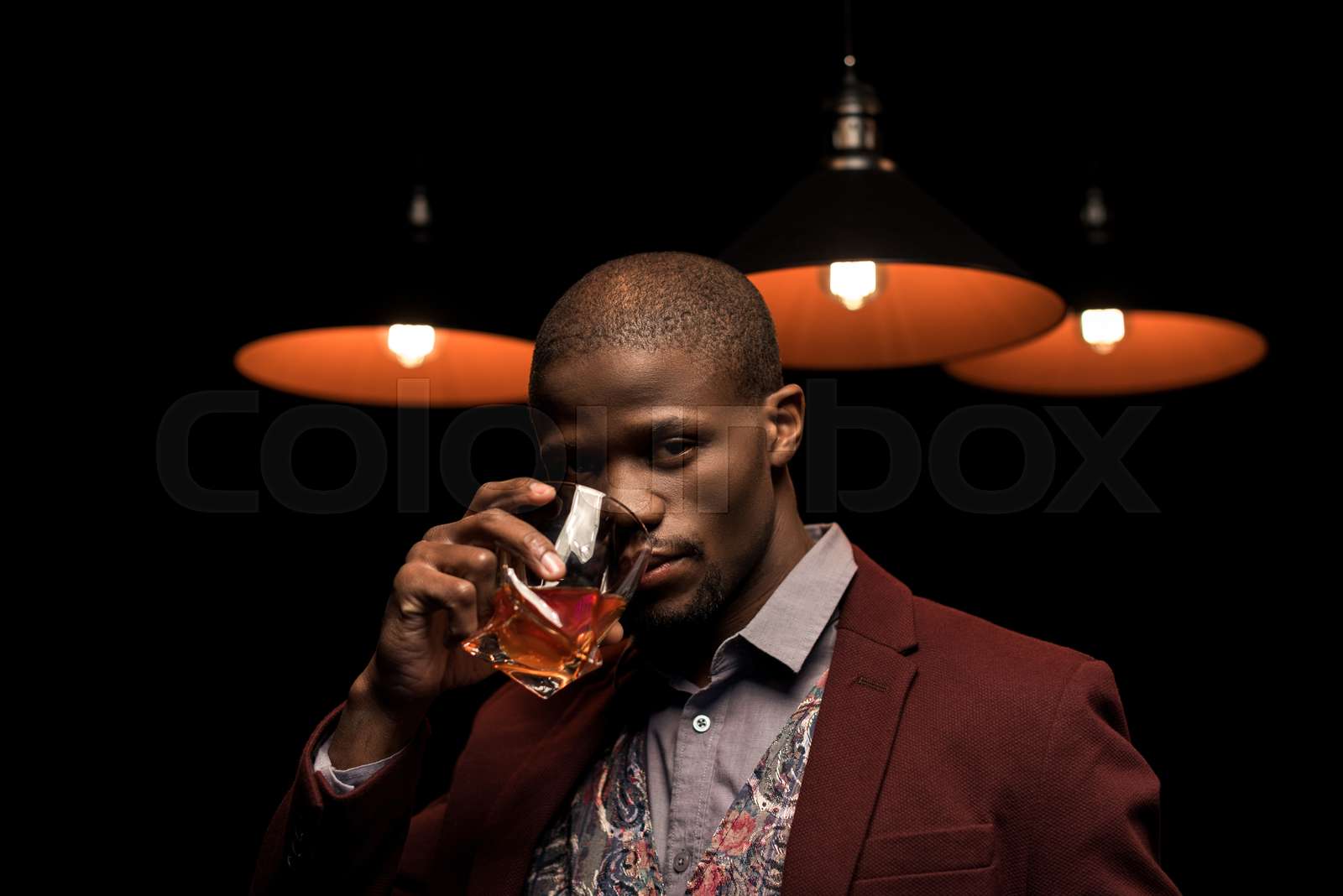 african american man drinking whiskey | Stock image | Colourbox