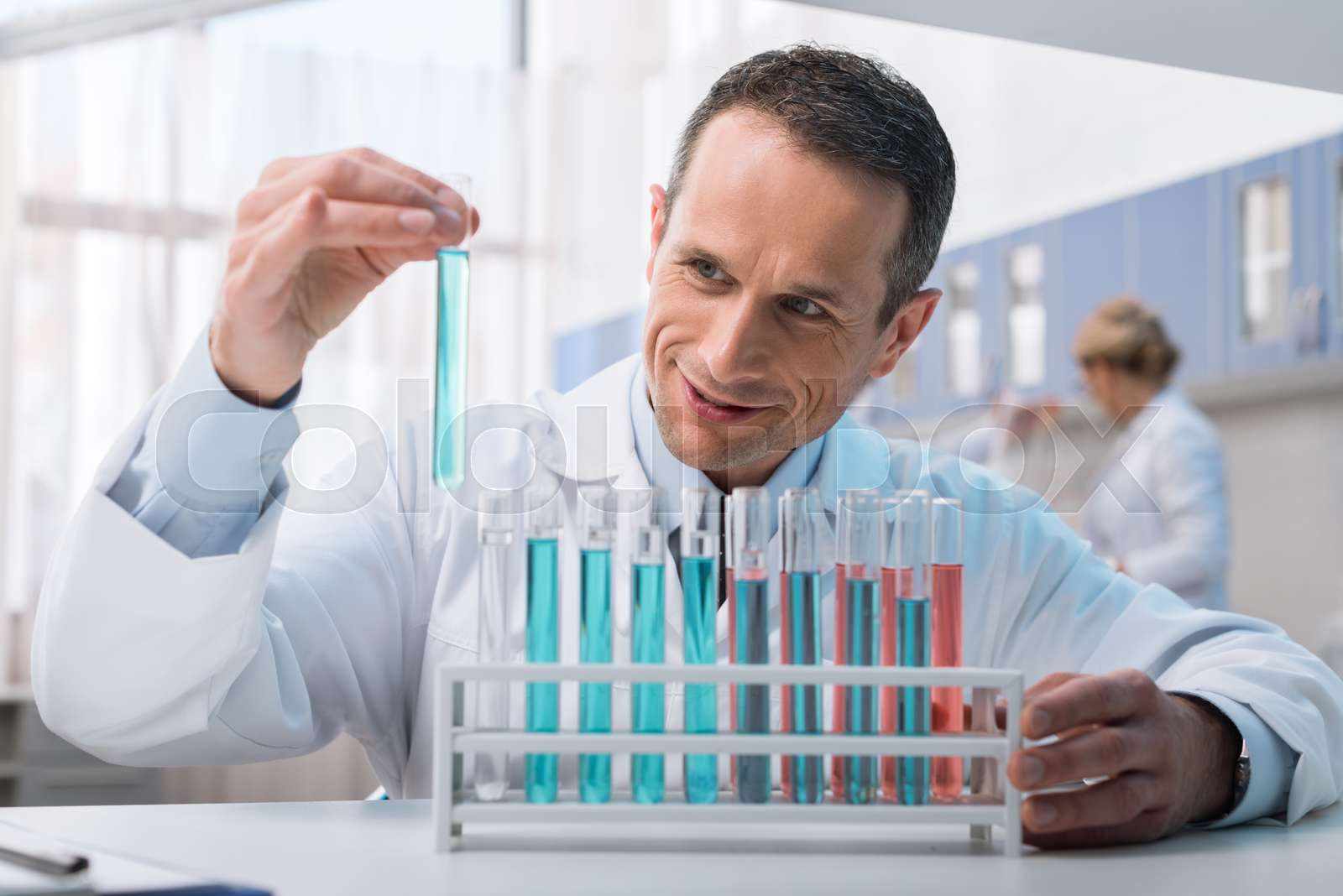 scientist holding test tube | Stock image | Colourbox