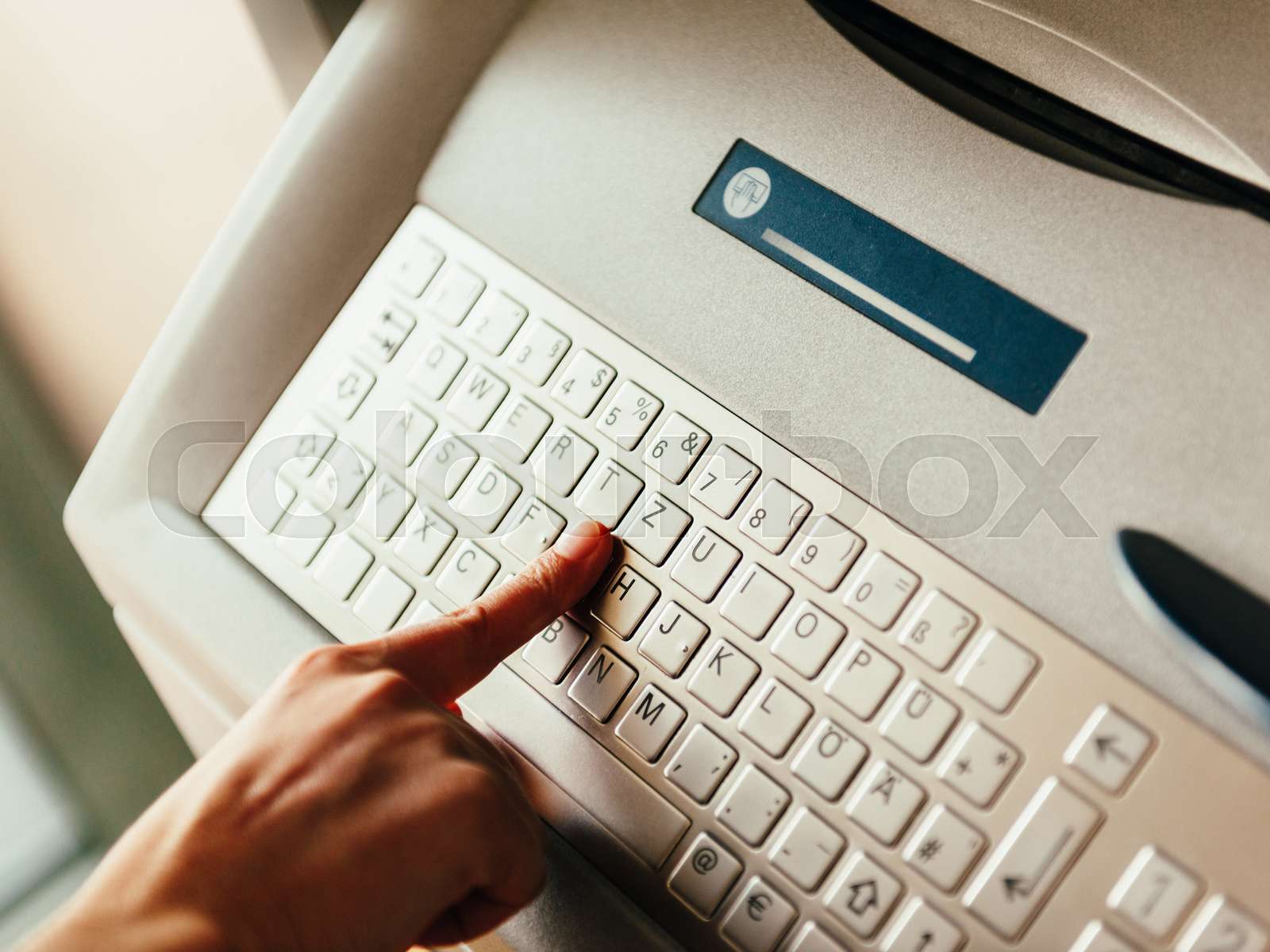 Using modern ATM keyboard | Stock image | Colourbox
