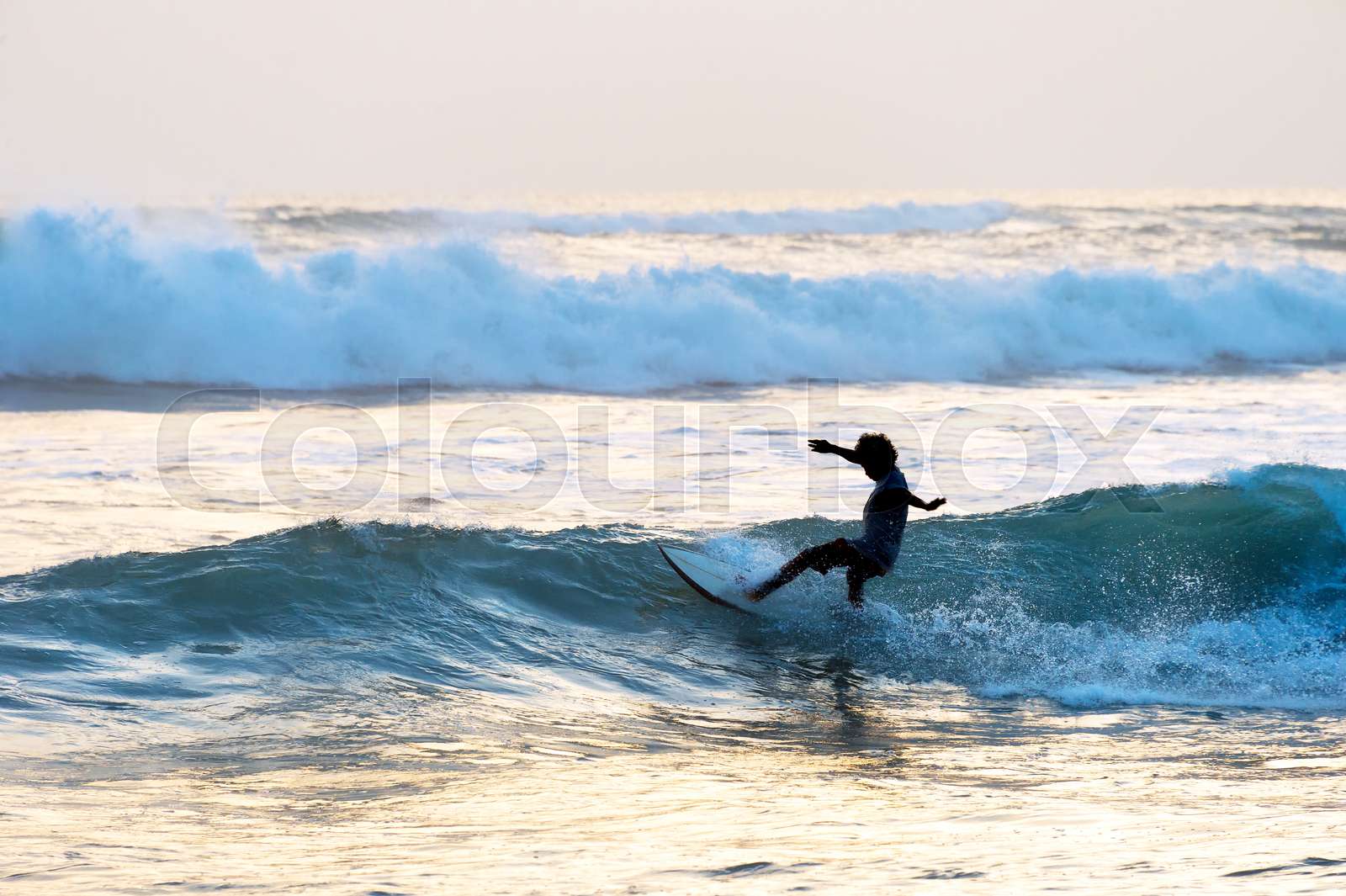Man surf in the ocean | Stock image | Colourbox