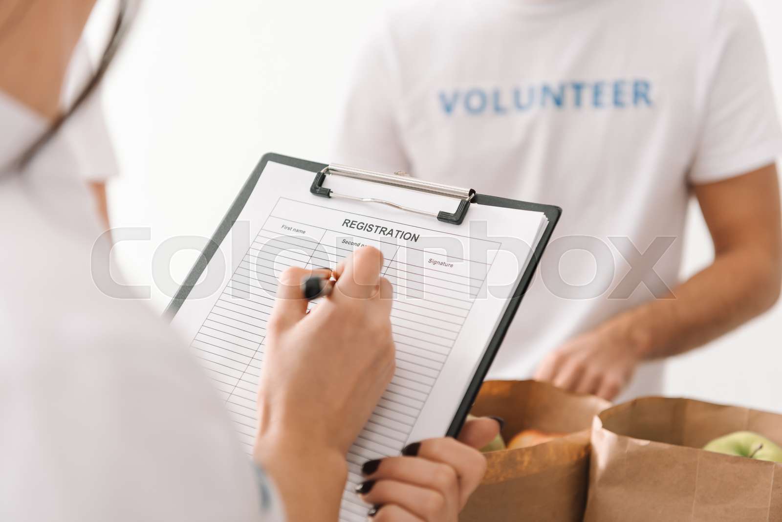 woman filling in registration form | Stock image | Colourbox