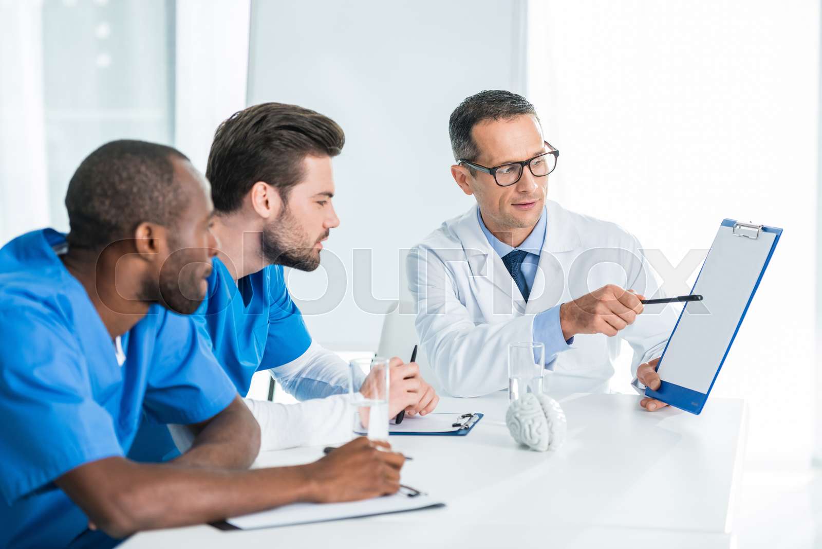 team of doctors having conversation | Stock image | Colourbox