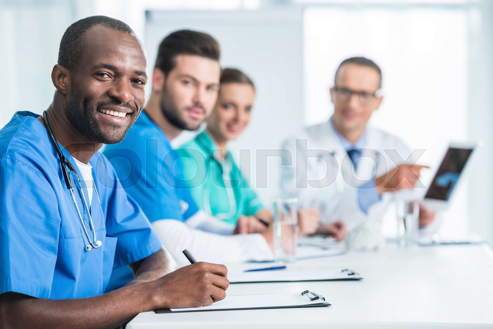 team of doctors having conversation | Stock image | Colourbox