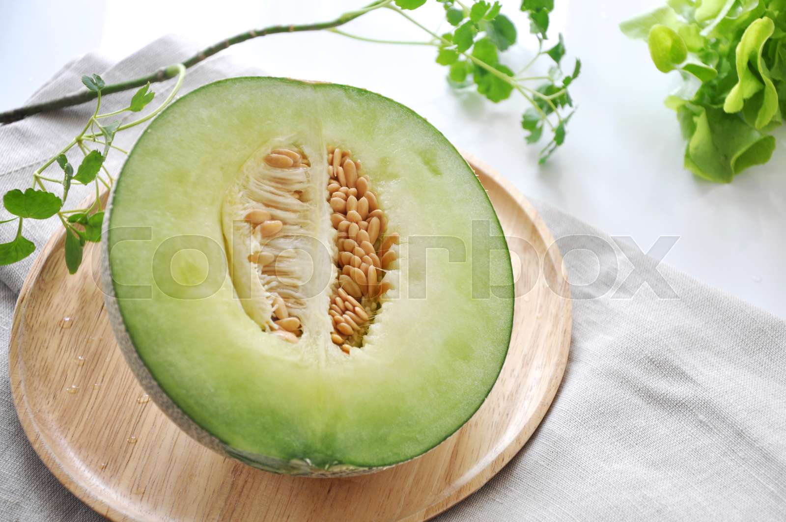 Fresh Japanese Green Melon on Wooden Plate | Stock image | Colourbox