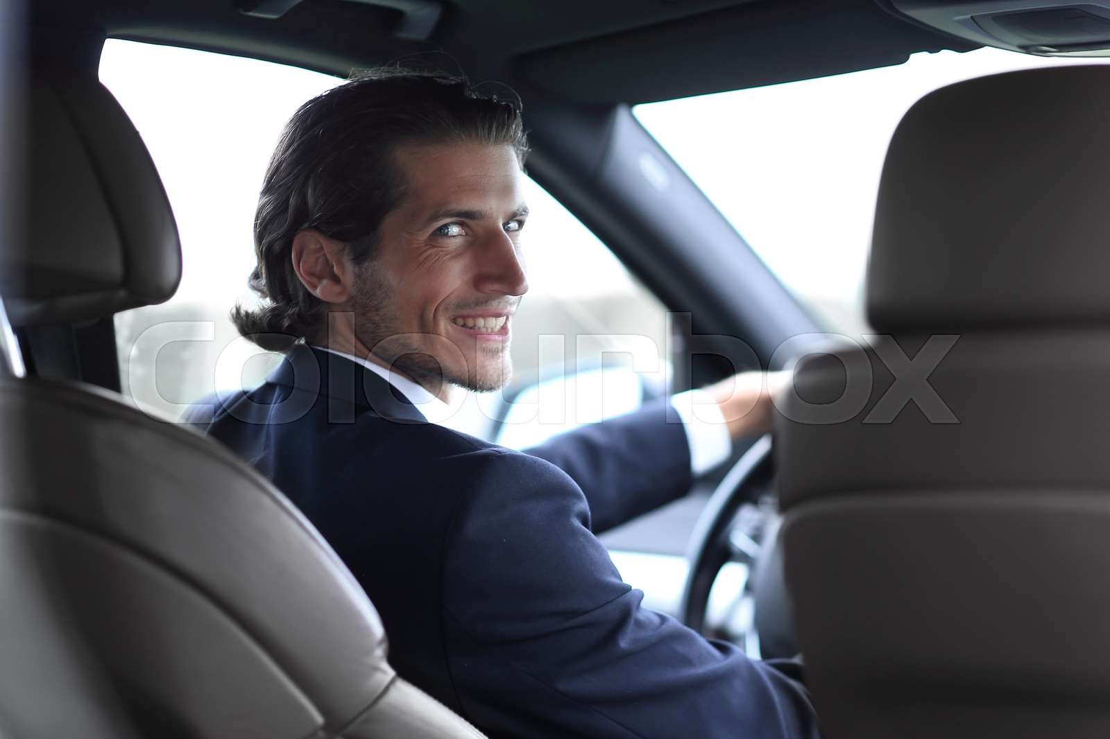 man sitting behind the wheel of a car | Stock image | Colourbox