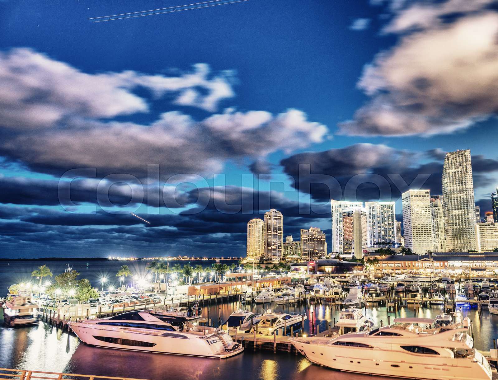 MIAMI, FL - JANUARY 2016: Downtown skyline at sunset. Miami is a major ...