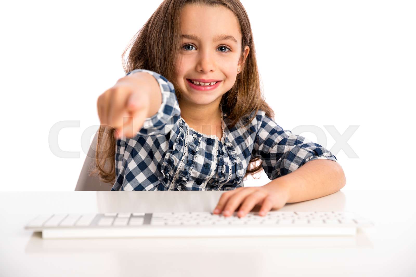 Little girl working with a computer | Stock image | Colourbox