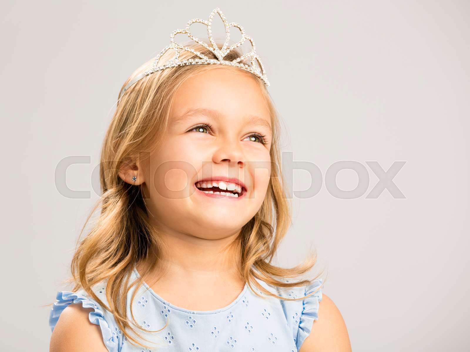 Cute little princess laughing | Stock image | Colourbox