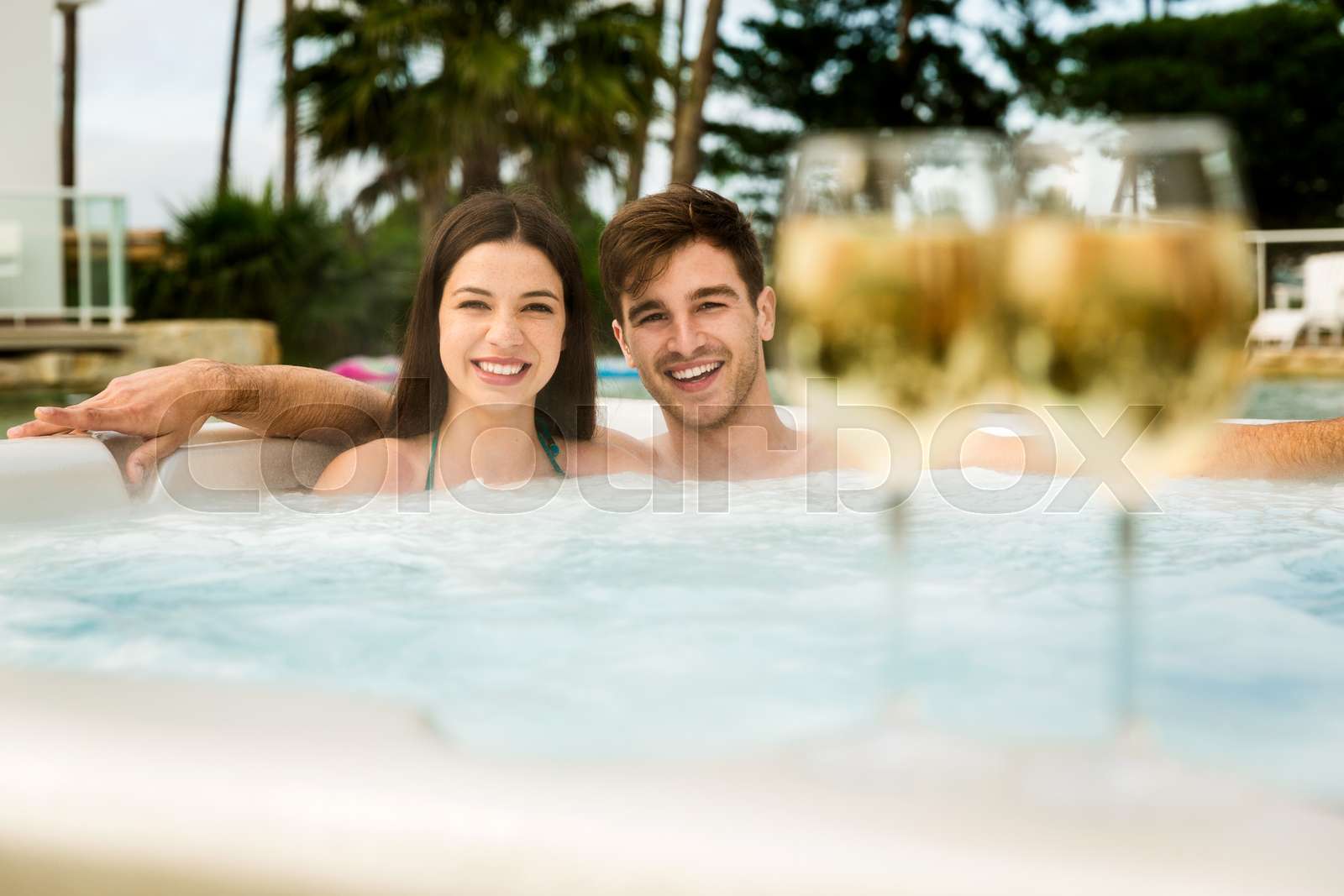Tasting wine in a jacuzzi | Stock image | Colourbox