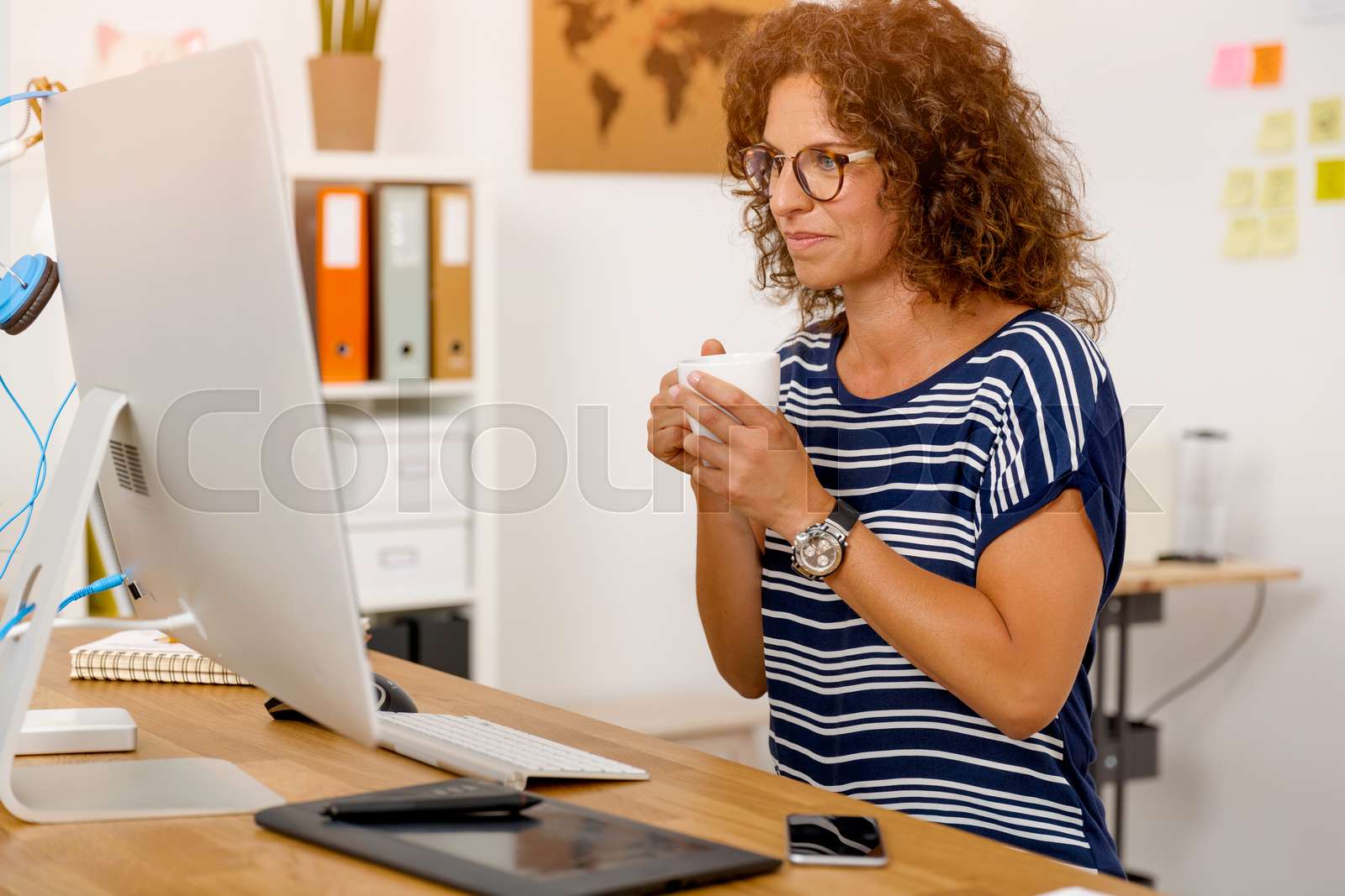 Coffee break at work | Stock image | Colourbox