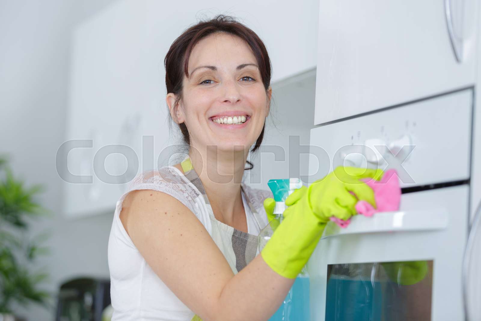 woman cleaning the kitchen adult woman washing house | Stock image ...