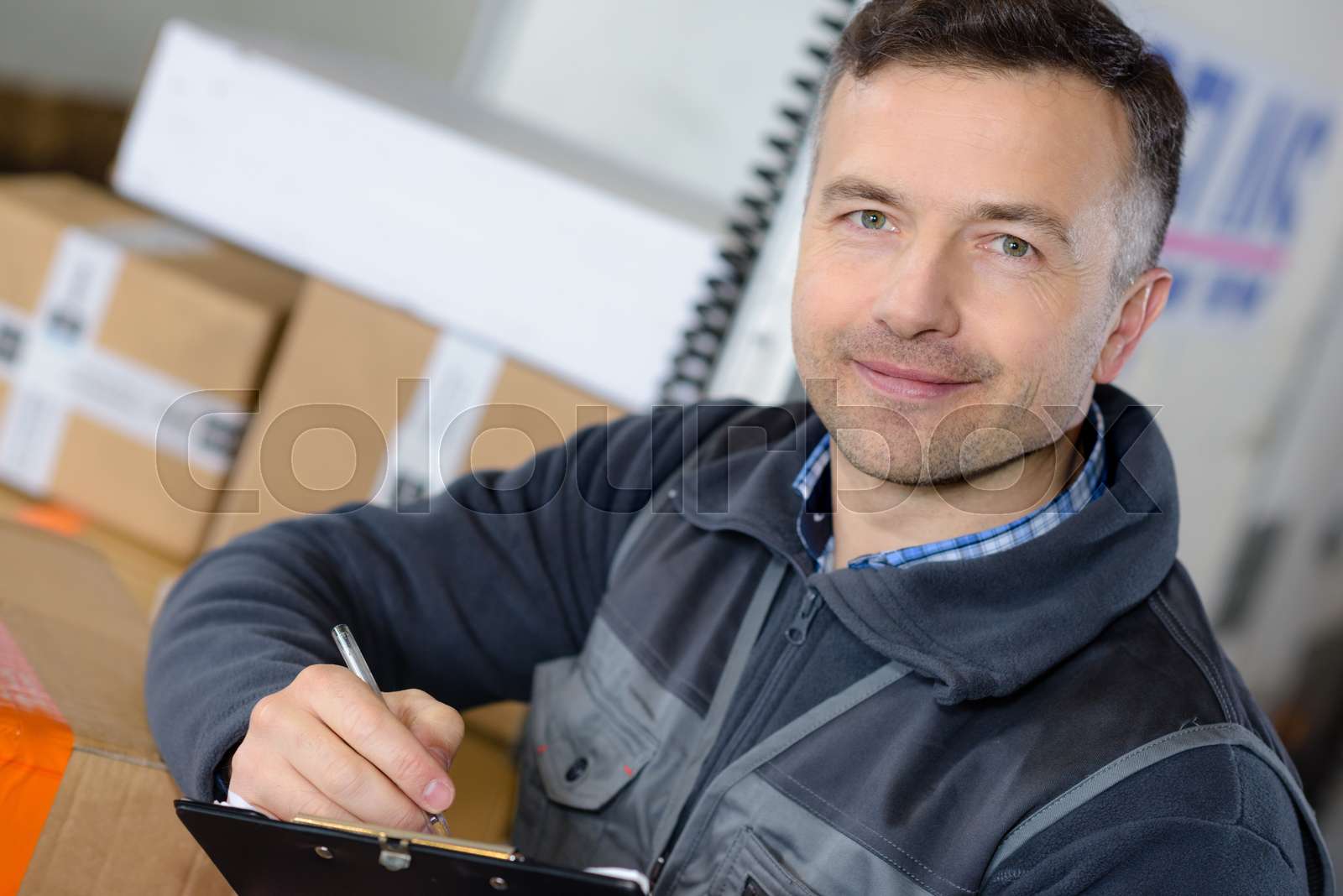 delivery man with parcel near cargo truck shipping service | Stock ...