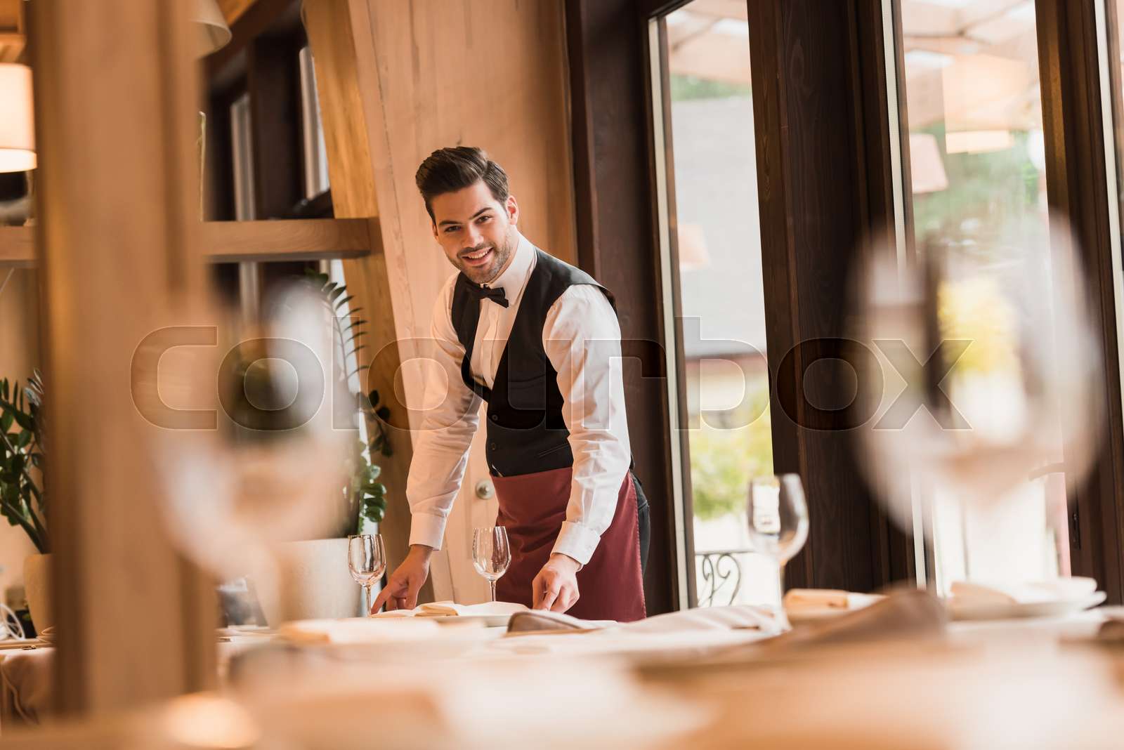 waiter serving tables | Stock image | Colourbox