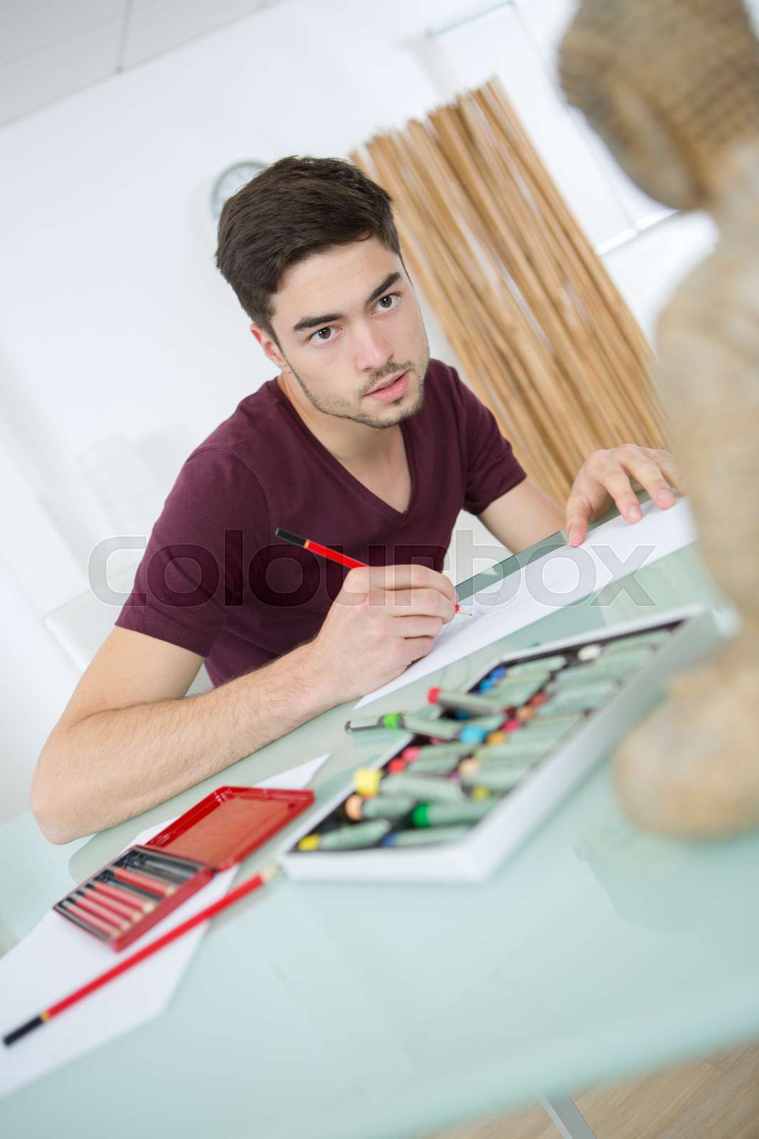 Male artist doing still life drawing | Stock image | Colourbox
