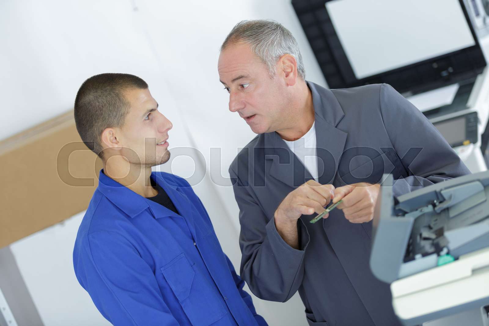 office technicians having a conversation | Stock image | Colourbox
