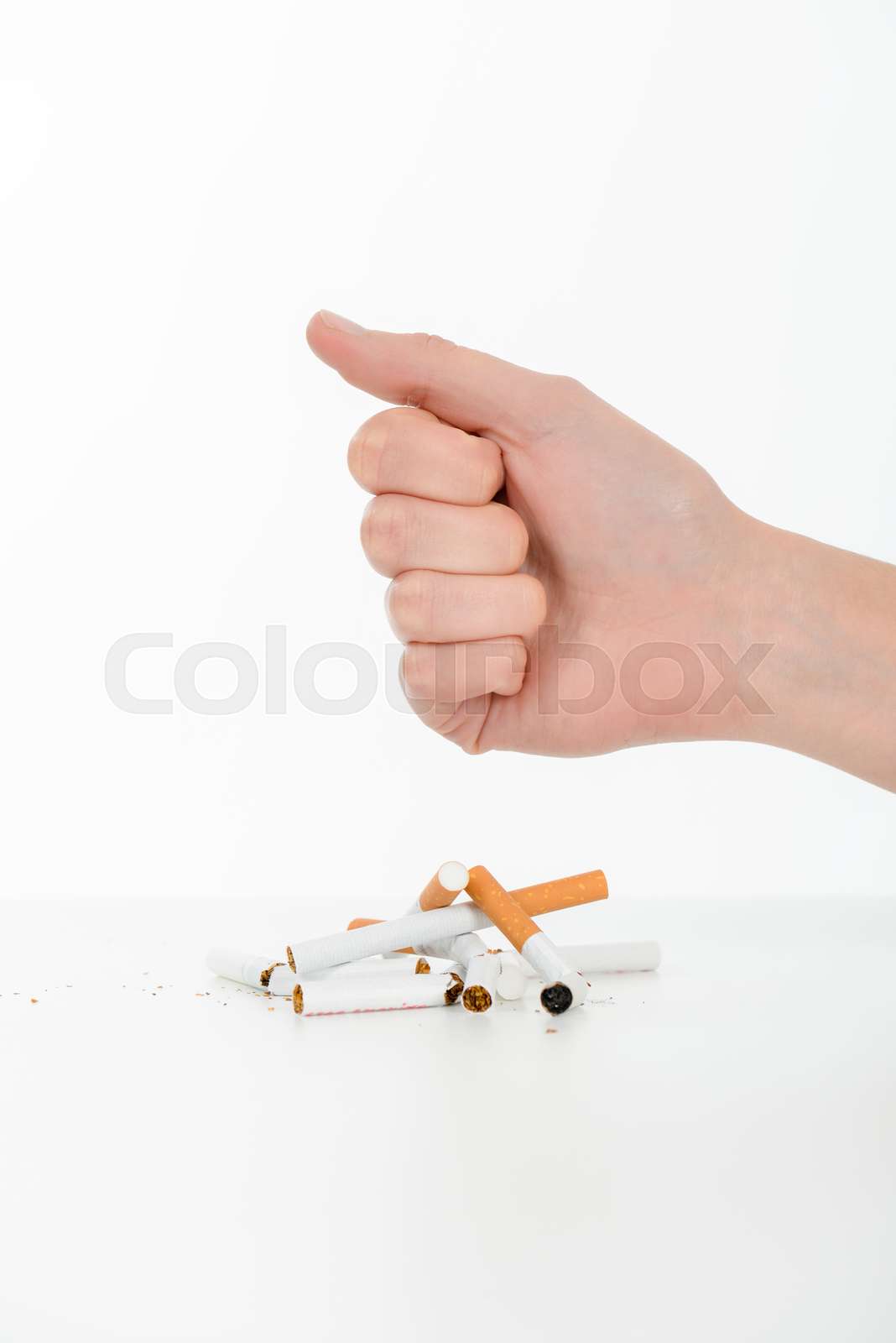Hand crushing cigarettes | Stock image | Colourbox