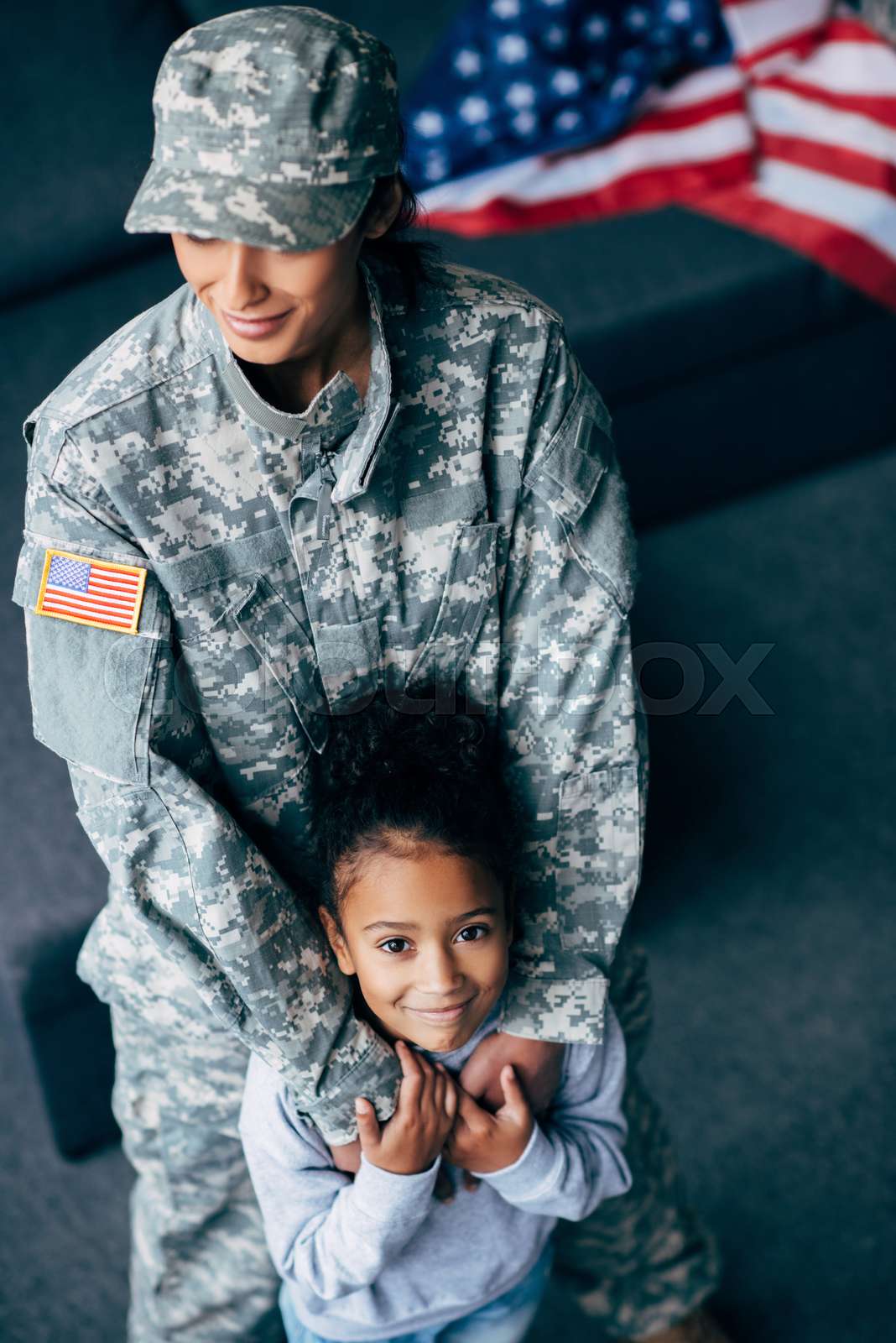 daughter and mother in military uniform | Stock image | Colourbox