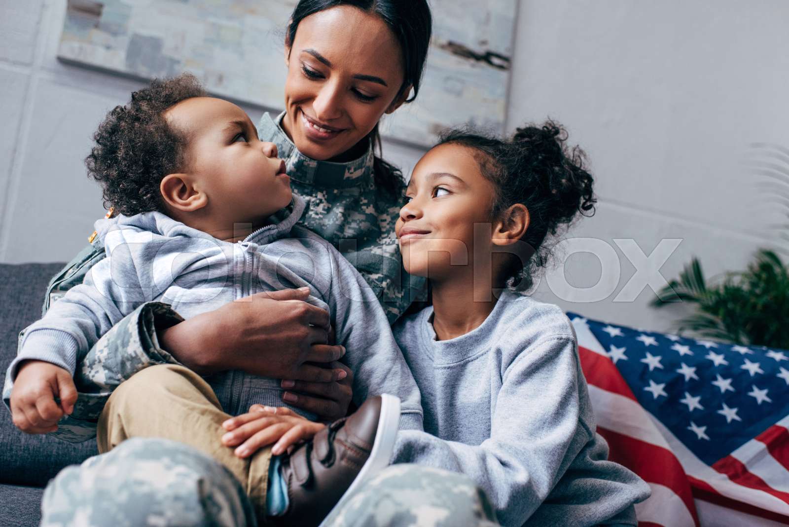 children with mother in military uniform | Stock image | Colourbox