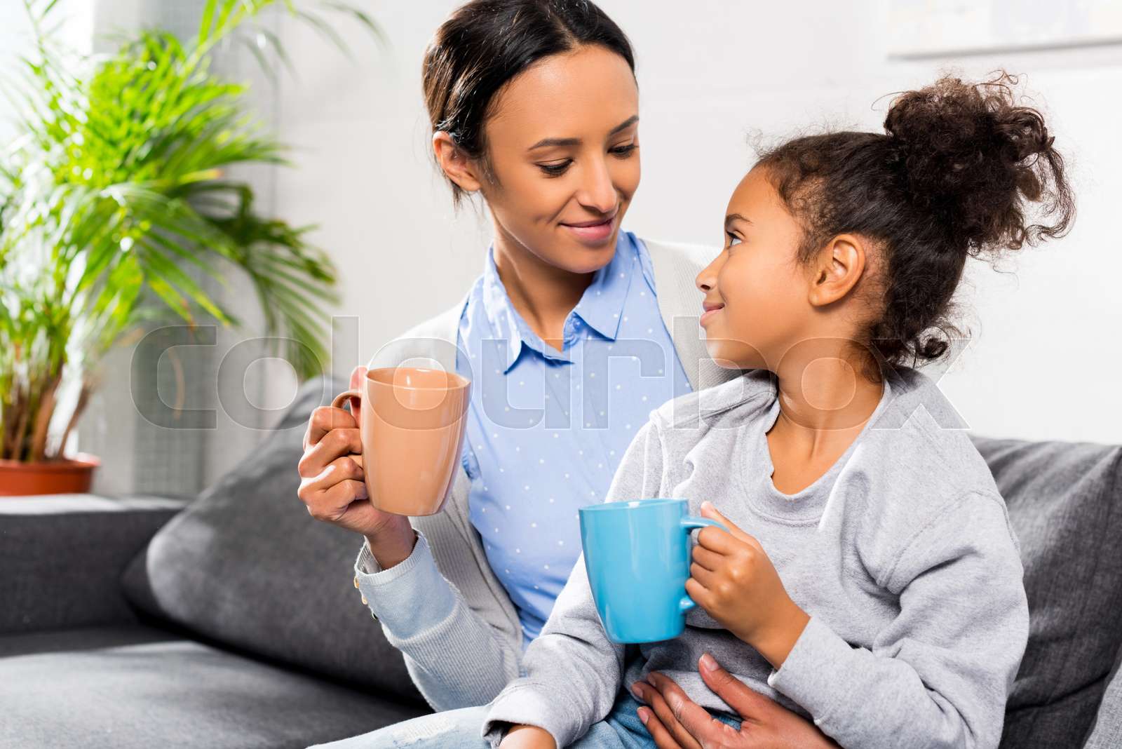 mother and daughter drinking tea | Stock image | Colourbox