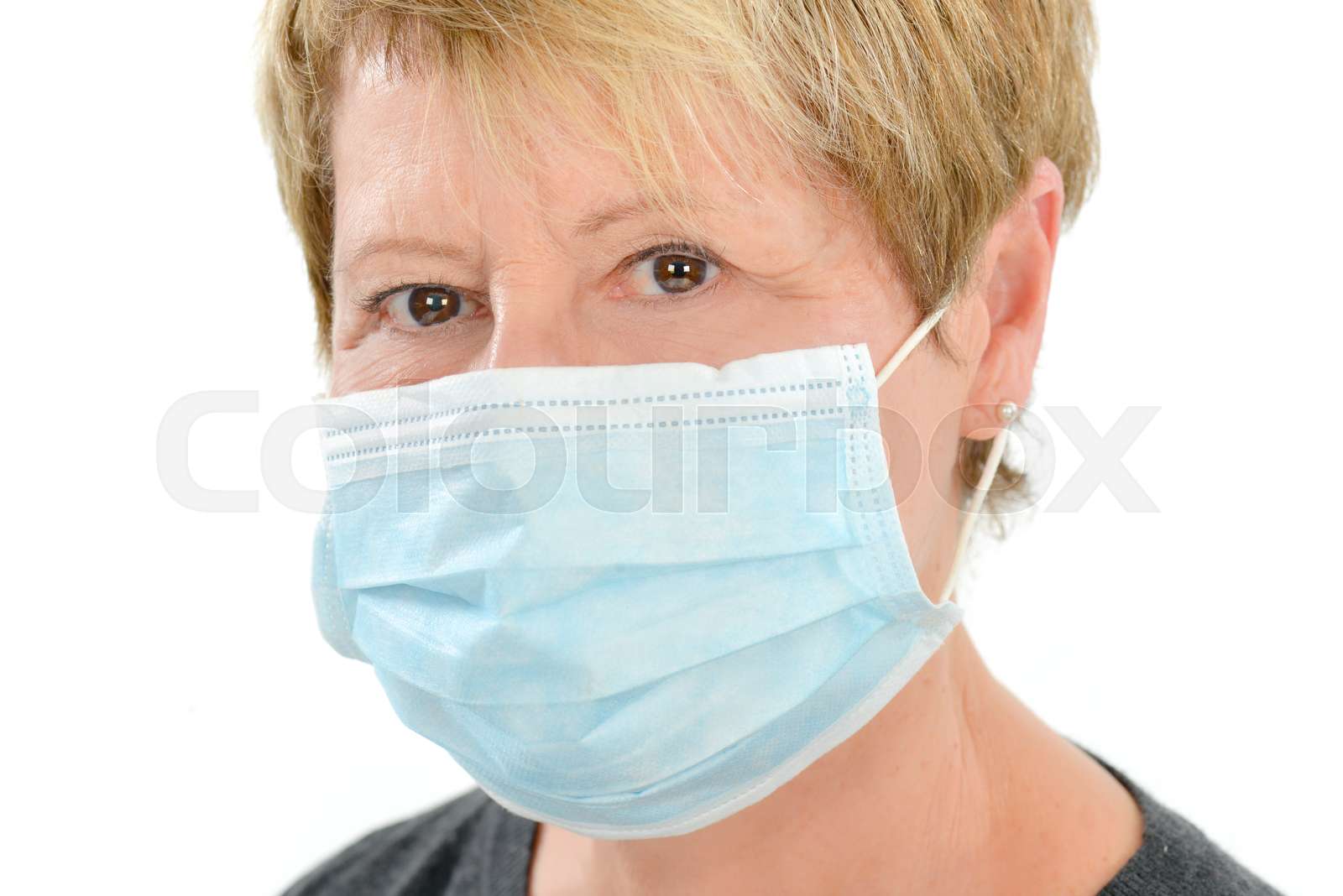 Old woman wearing a face mask | Stock image | Colourbox