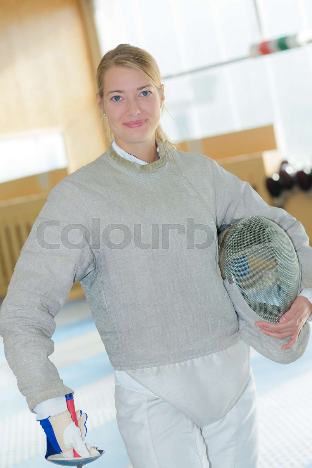 Woman wearing fencing outfit | Stock image | Colourbox