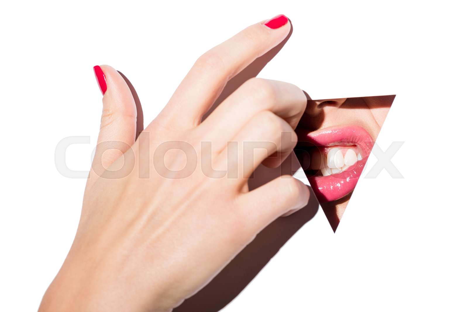 woman lips behind triangle hole | Stock image | Colourbox