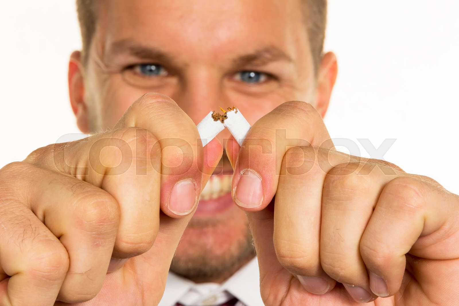 man breaks cigarette | Stock image | Colourbox
