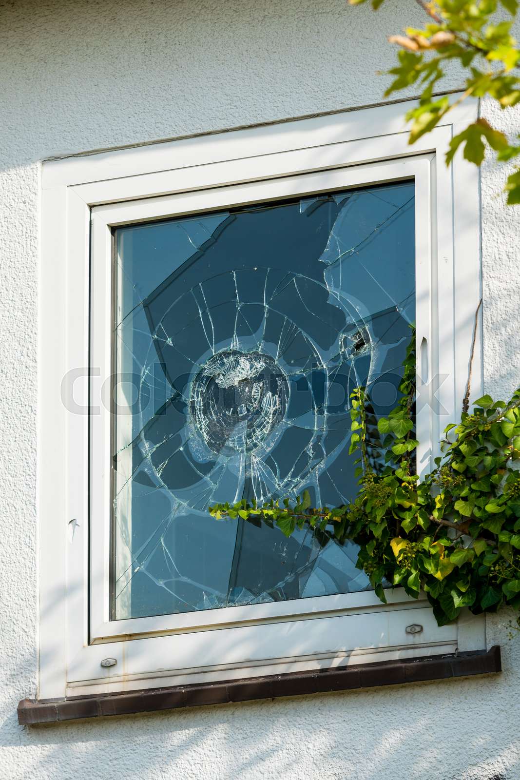 Broken glass window outside | Stock image | Colourbox